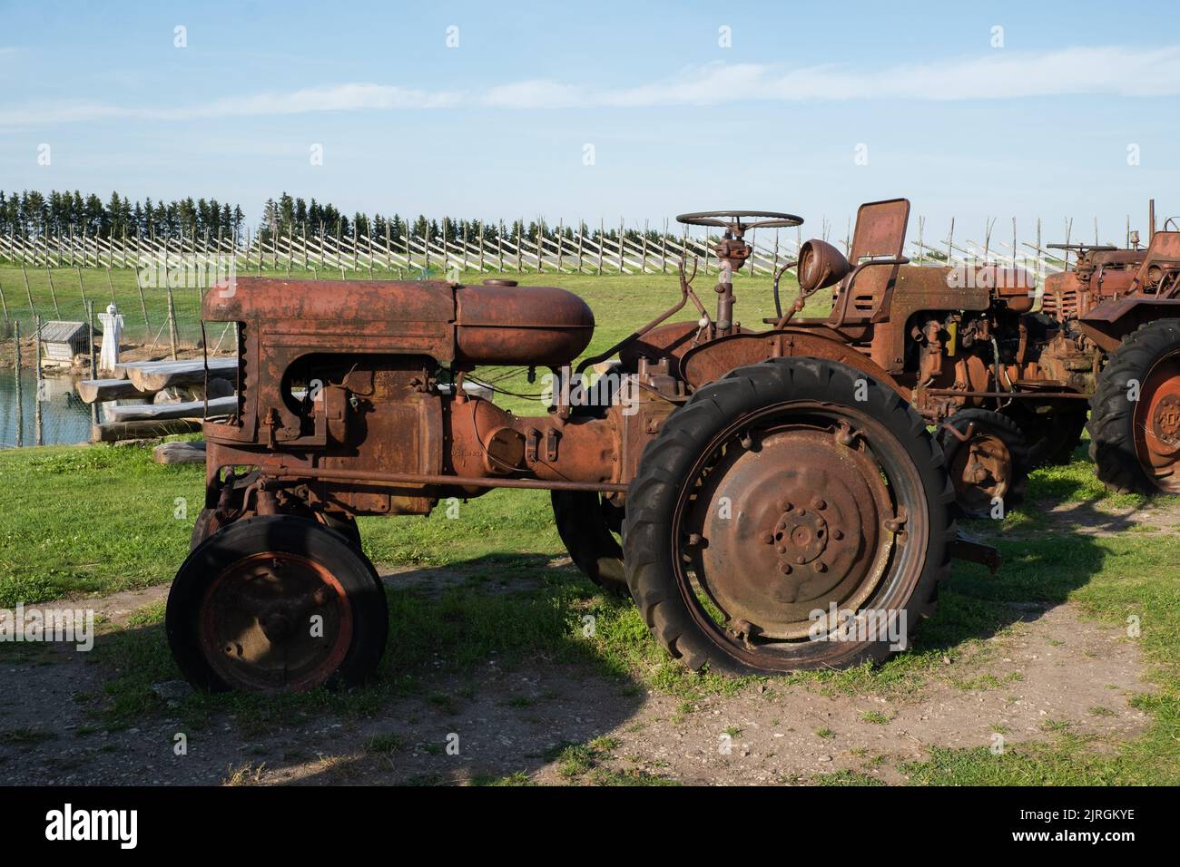 Broken rusty tracktor Stock Photo - Alamy
