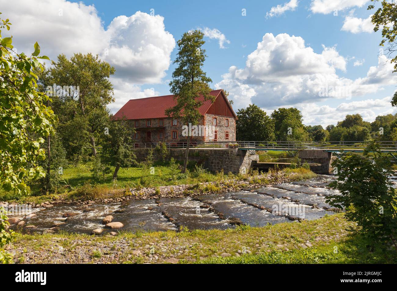 Rural house by the river Stock Photo - Alamy