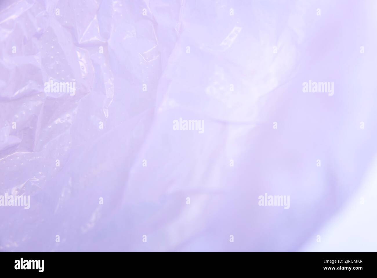 Green and purple background, single use plastic bags. Concepts ...