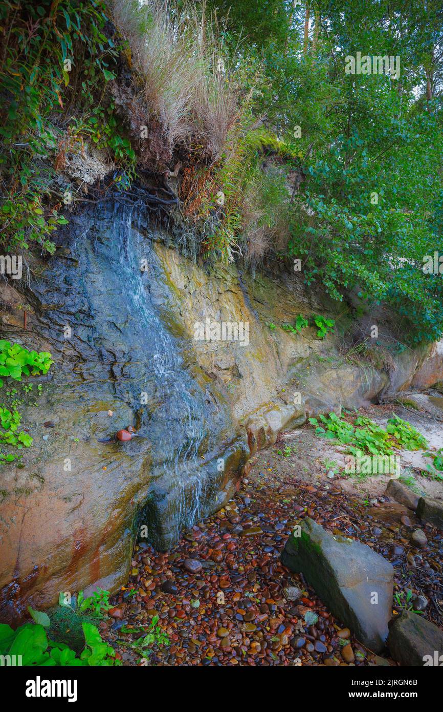 Baltic sea limestone rocky coast, cliff. Estonia. Small waterfall Stock ...