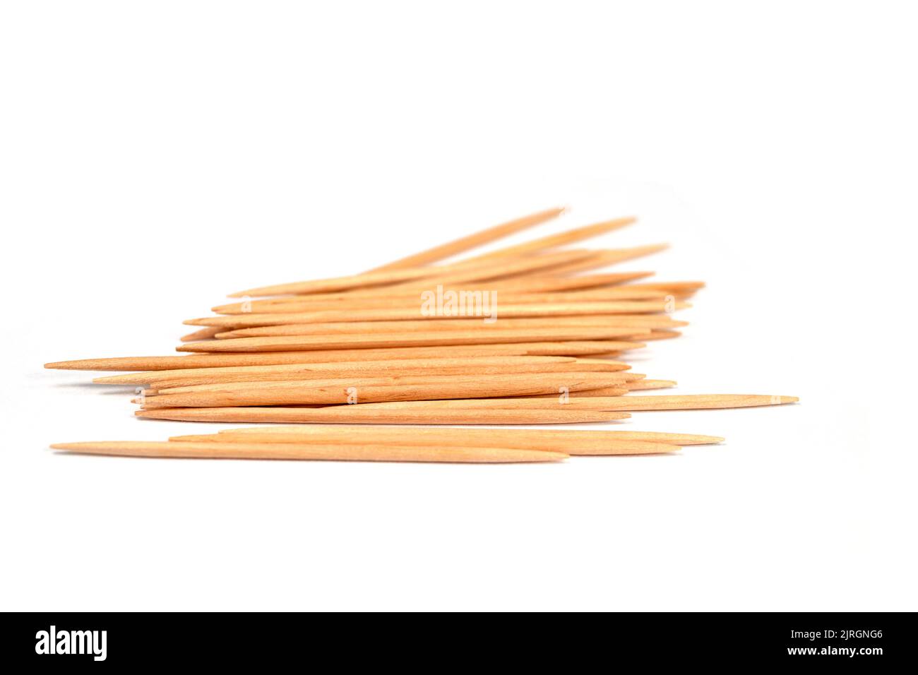 Wooden toothpicks against white background Stock Photo - Alamy