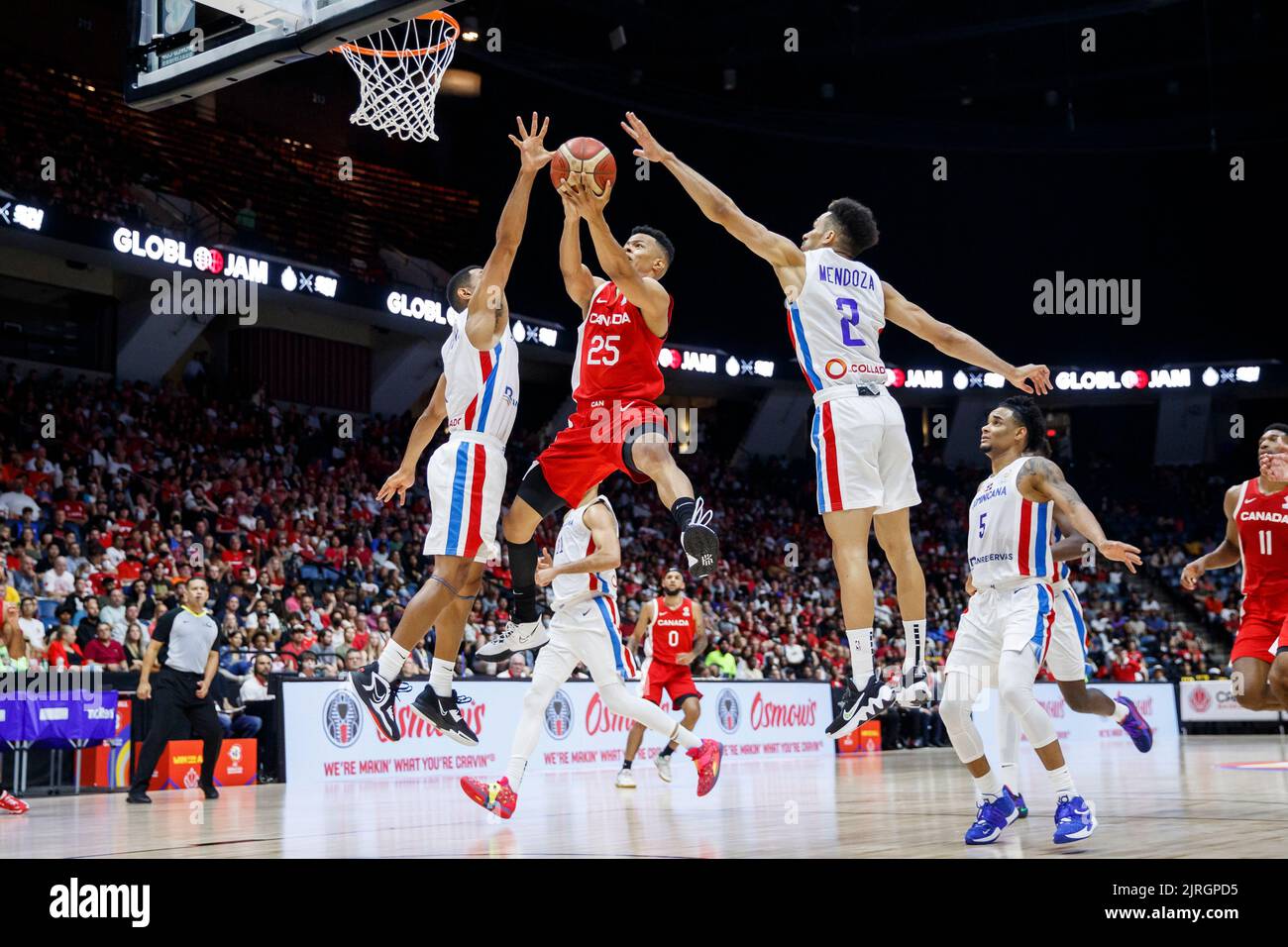 Canada's Trae Bell-Haynes (25) drives to the net between Dominican ...