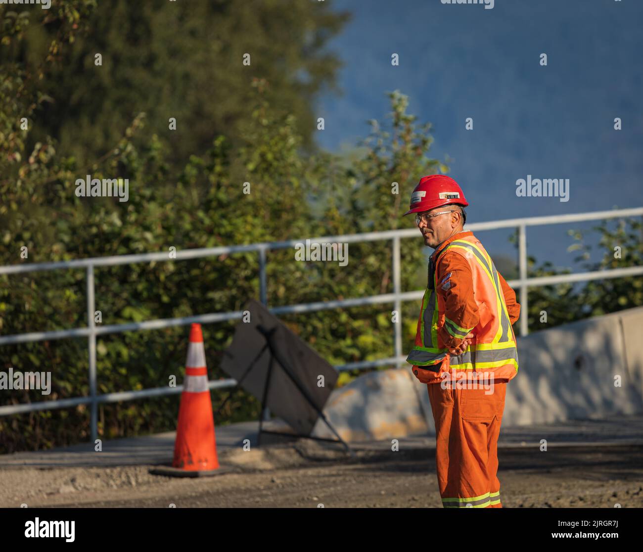 Road worker construction. Road workers inspecting construction. Engineer worker tablet working ...