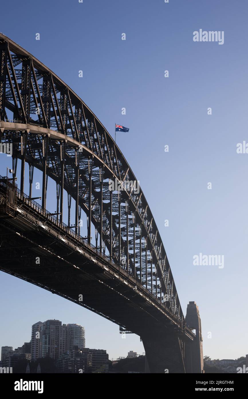 A vertical closeup of the Sydney Harbour Bridge in the daytime with the ...