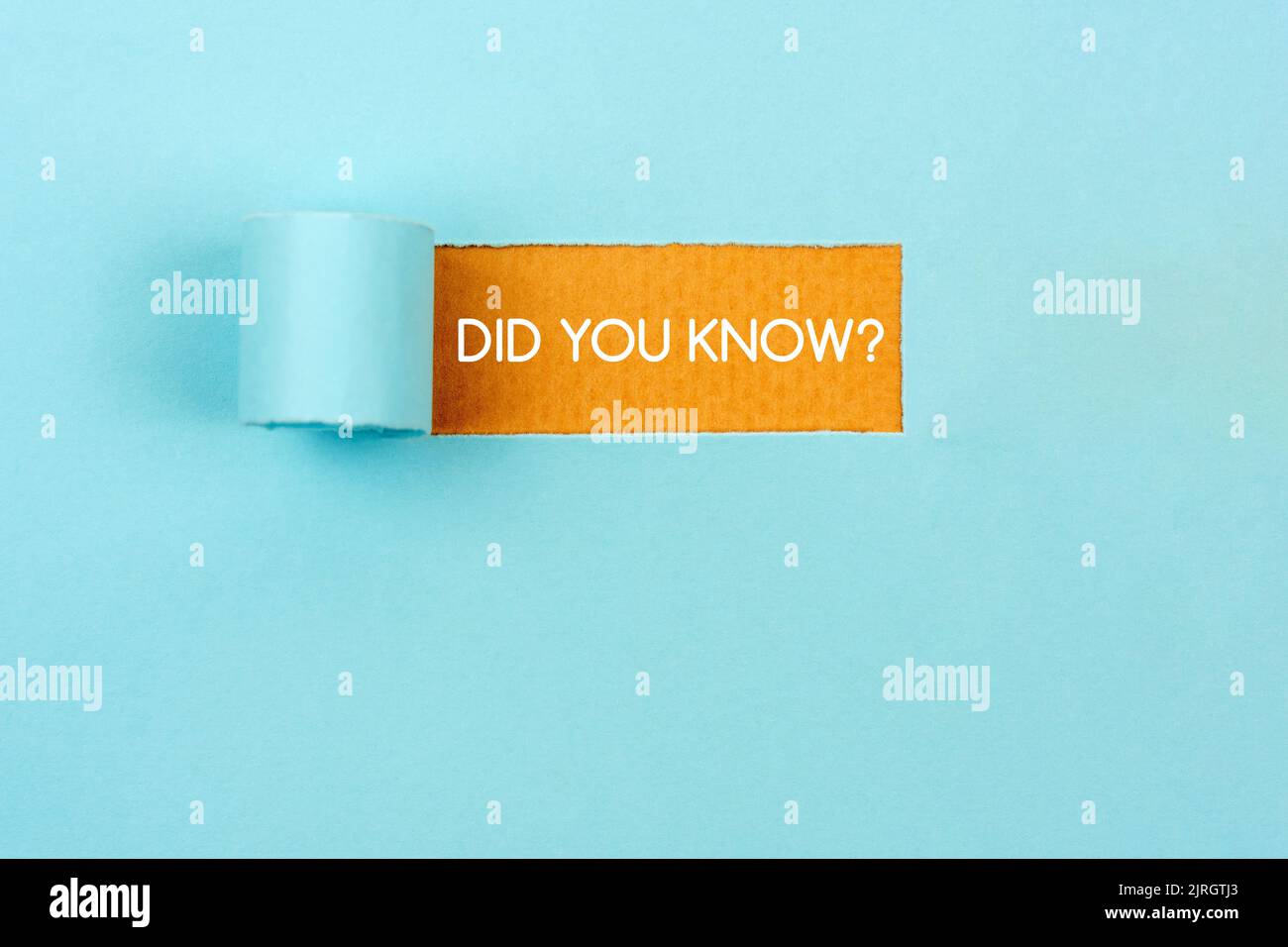 Did you know? text on torn paper blue background Stock Photo - Alamy