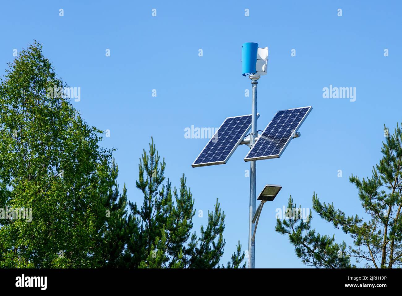 Pole with innovative LED street light powered by solar cells and small ...