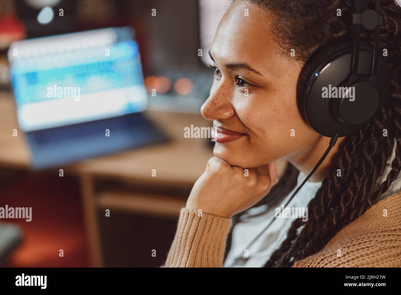 Close-up charming African woman, songwriter, sound engineer, singer ...