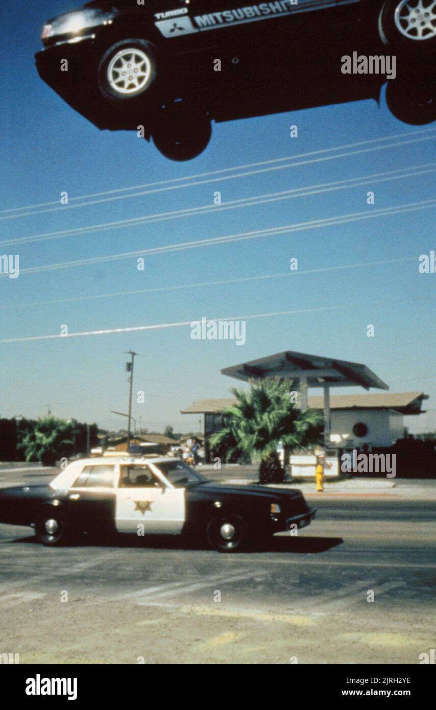 FLYING CAR STUNT, POLICE CAR, CANNONBALL RUN II, 1984 Stock Photo - Alamy