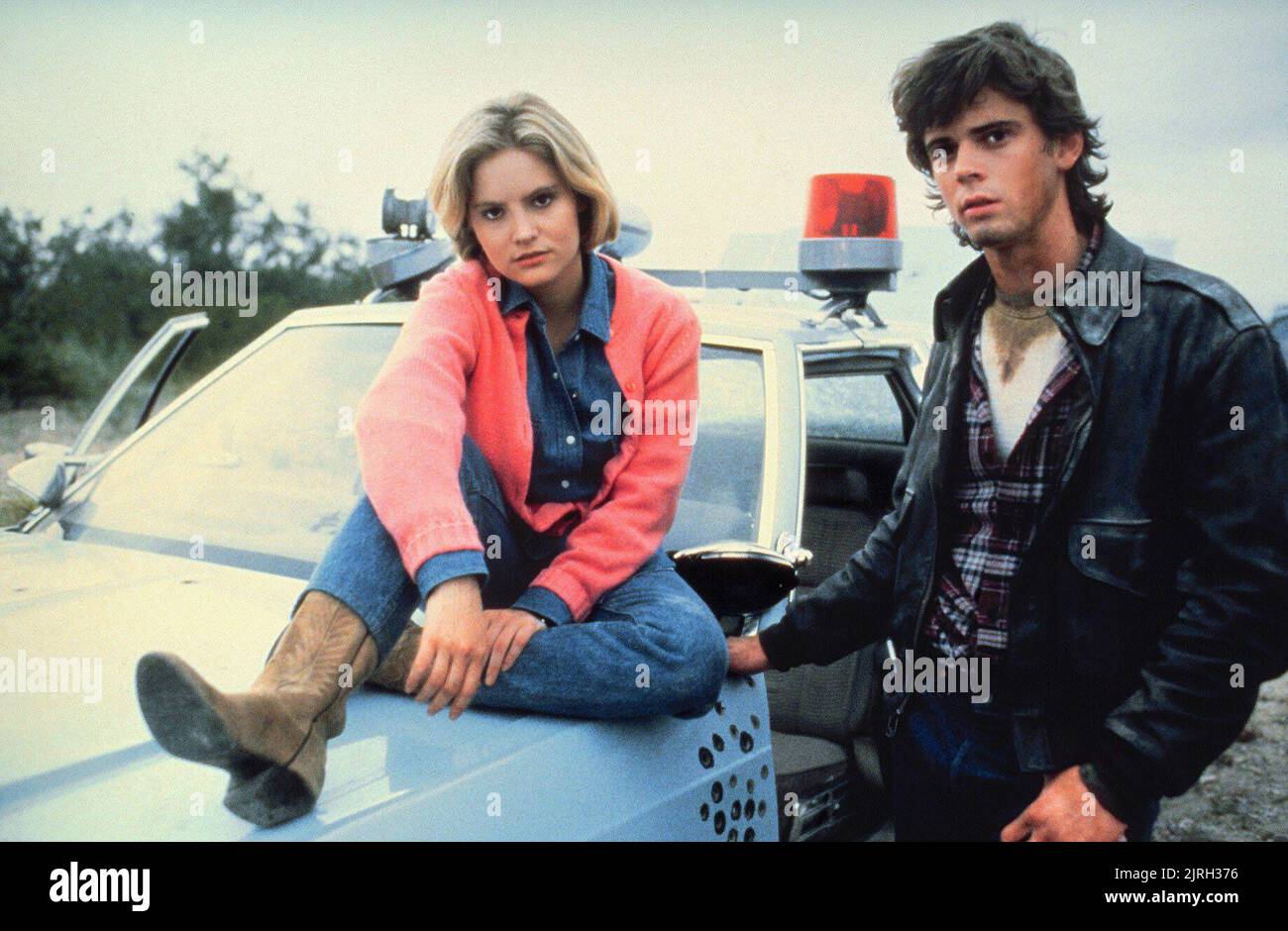 JENNIFER JASON LEIGH, C. THOMAS HOWELL, THE HITCHER, 1986 Stock Photo ...