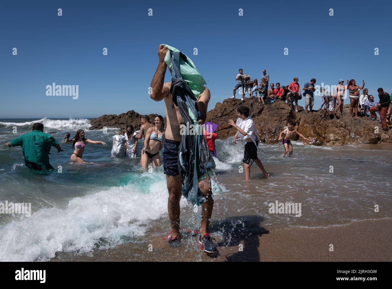 Porto, Portugal. 21st Aug, 2022. A man seen taking off his costume at ...