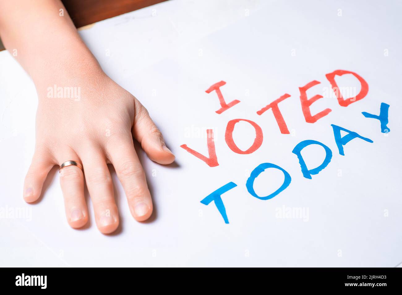 I voted today - inscription and a female hand on a white background ...