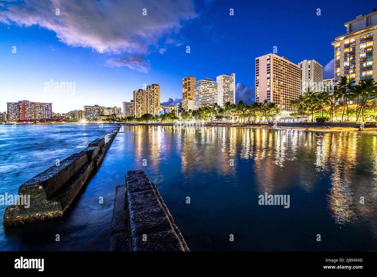 The sunset at Waikiki Beach, Oahu Hawaii with skyscrapers and city ...