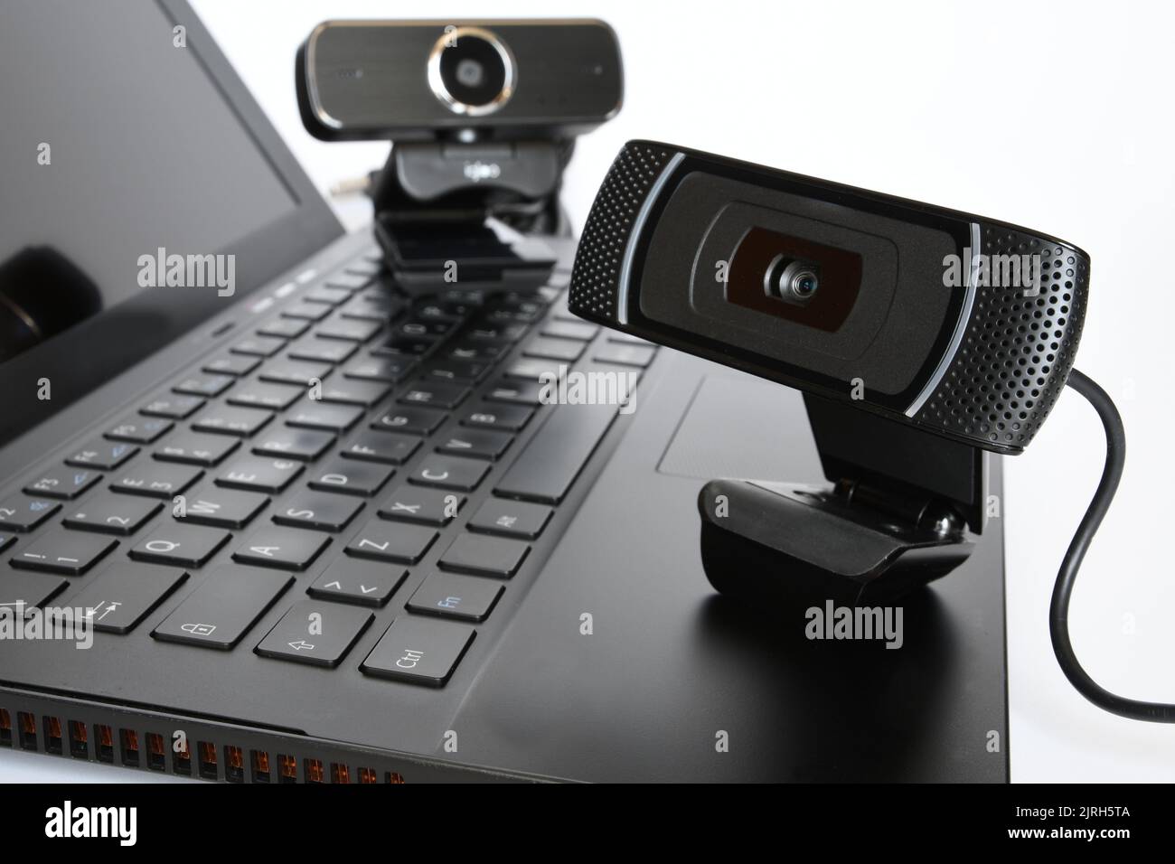 Black computer webcam on notebook keyboard Stock Photo - Alamy