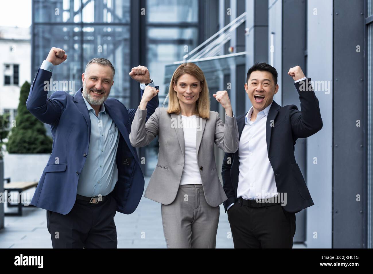 Success Happy Group business people excited rejoicing looking at camera ...