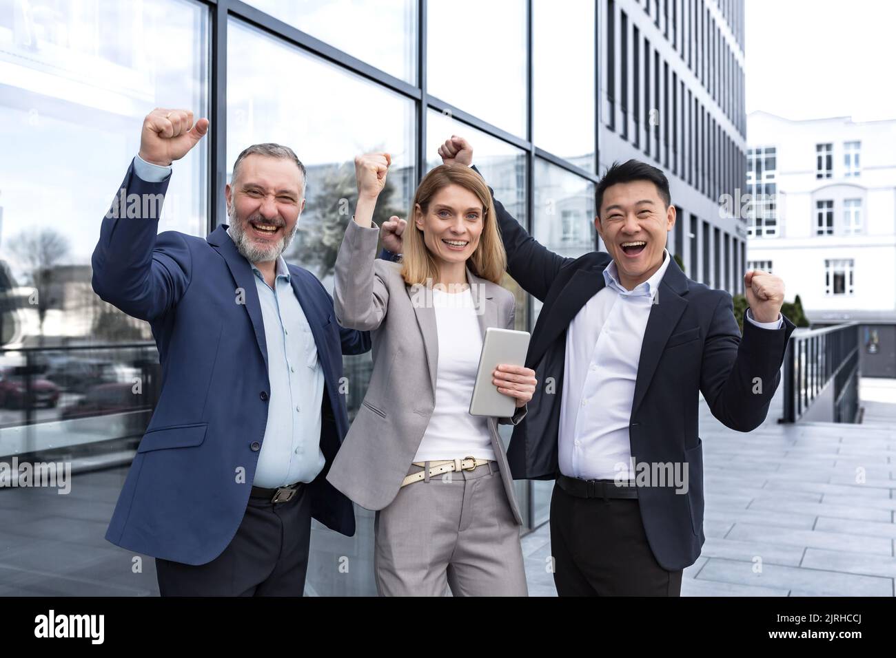 Success Happy Group business people excited rejoicing looking at camera ...