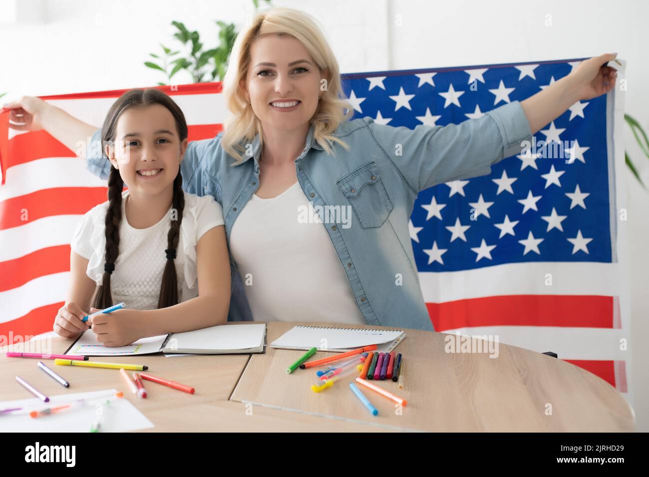Young girl learning english with teacher Stock Photo - Alamy