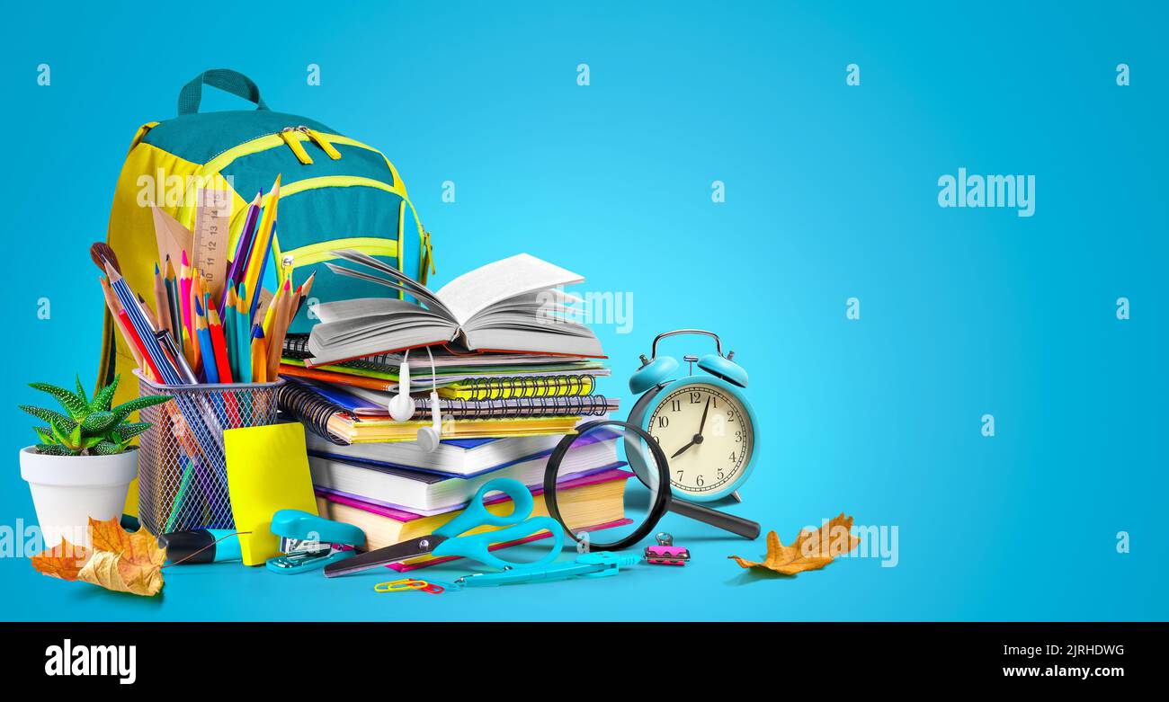 School supplies composition with school bag and open book Stock Photo ...
