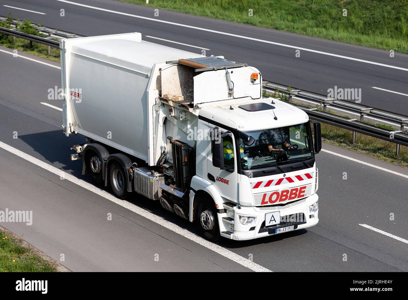 Lobbe Mercedes-Benz dustcart on motorway Stock Photo - Alamy