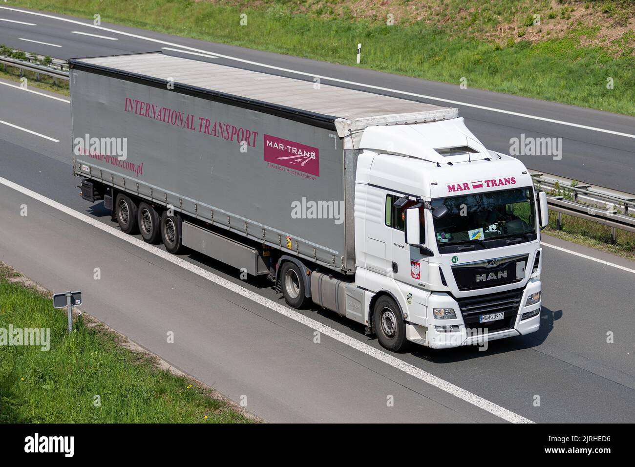 Mar-trans MAN TGX truck with curtainside trailer on motorway Stock ...