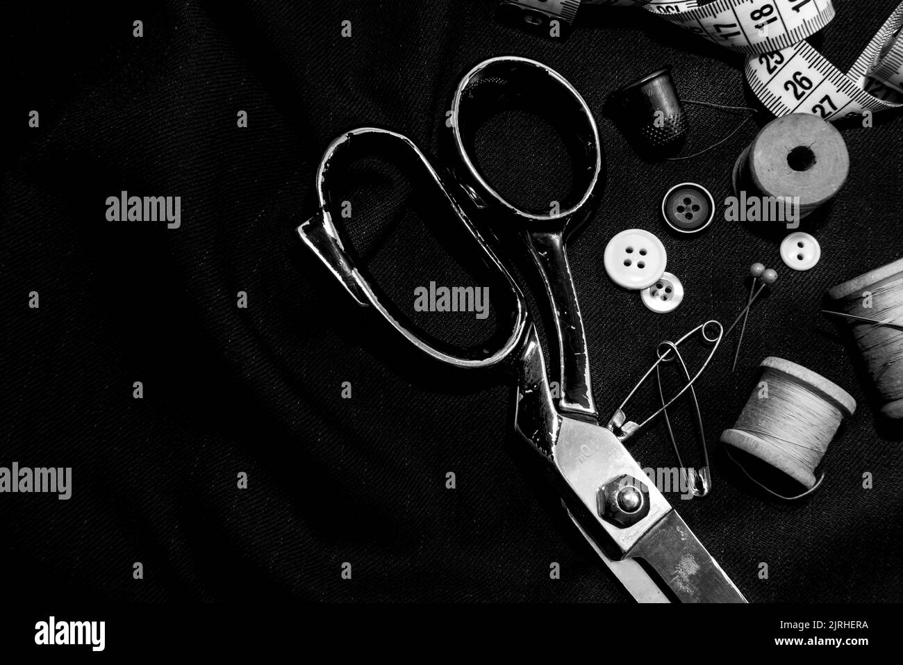 Retro tools for cutting and sewing. Needle with thread, thimble, sewing ...