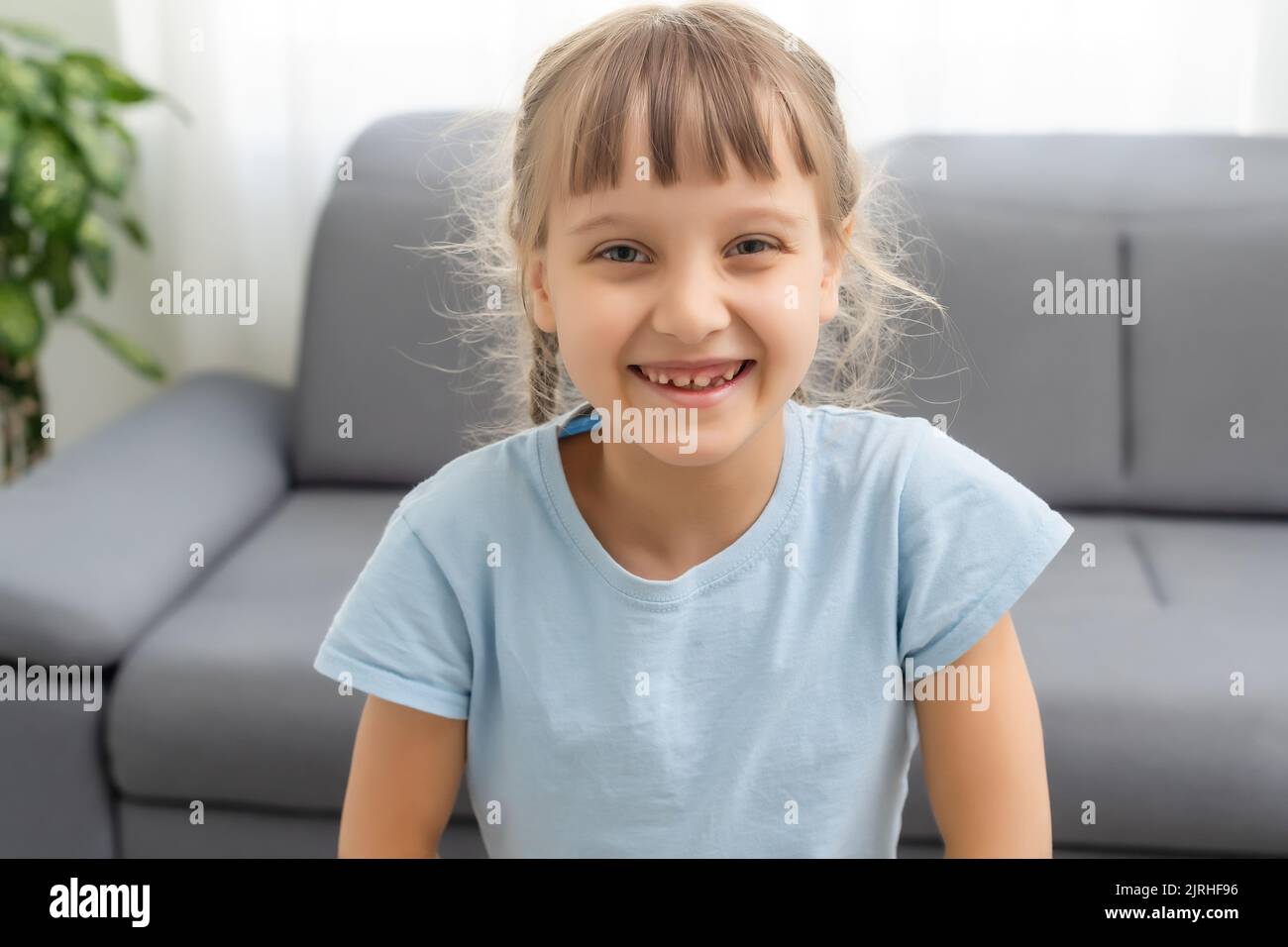 Adorable cute little vlogger looking at webcam, smiling child girl ...