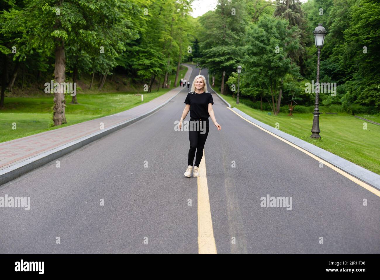 Woman legs walk along asphalt hi-res stock photography and images - Alamy