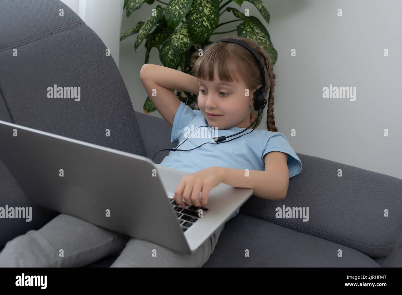 Homeschool little young girl student learning virtual internet online ...