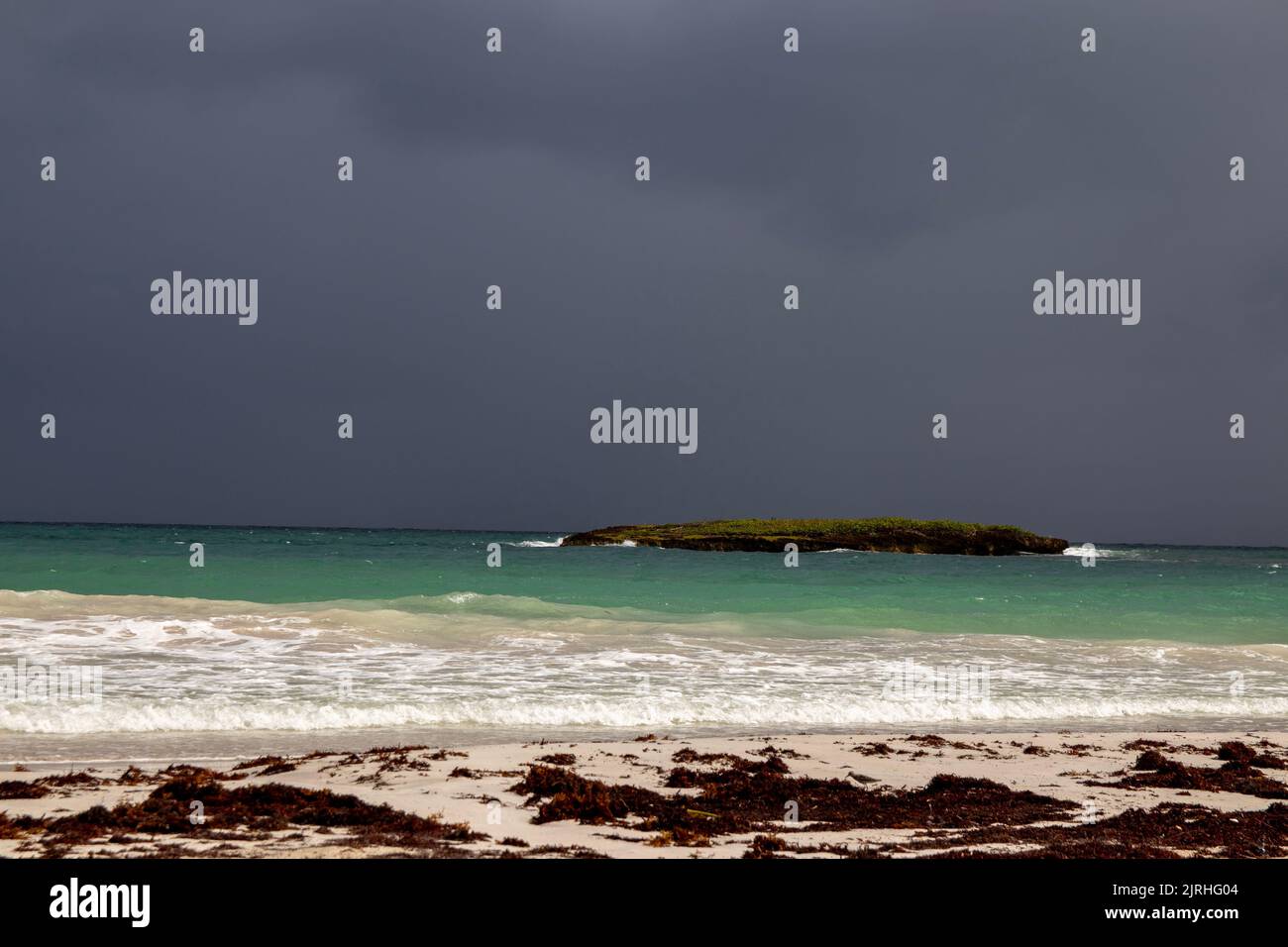 An aerial view of an empty coast on a cloudy day with a dark sky.The ...