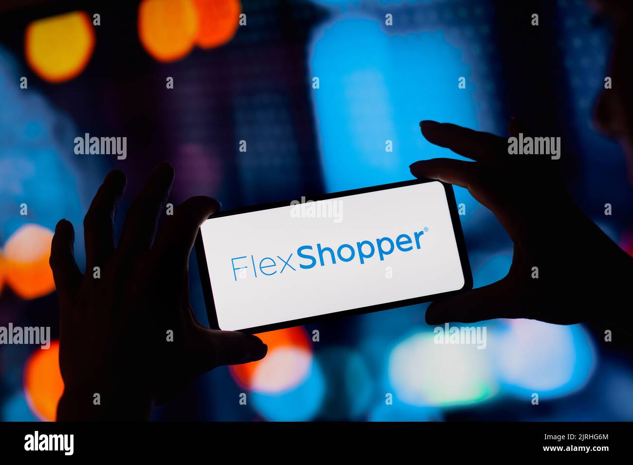 In this photo illustration, the FlexShopper logo is displayed on a ...