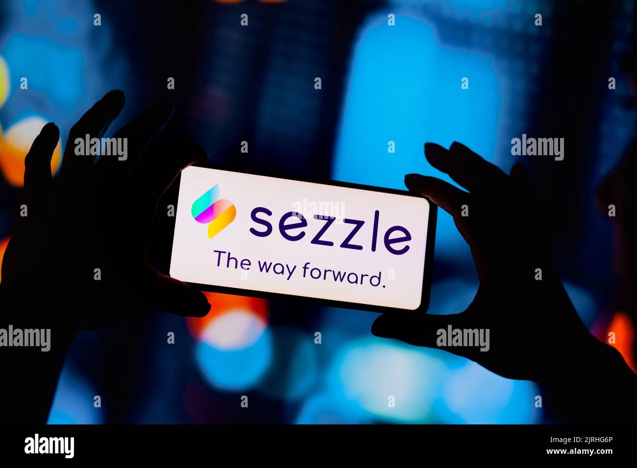 In this photo illustration, the Sezzle logo is displayed on a ...