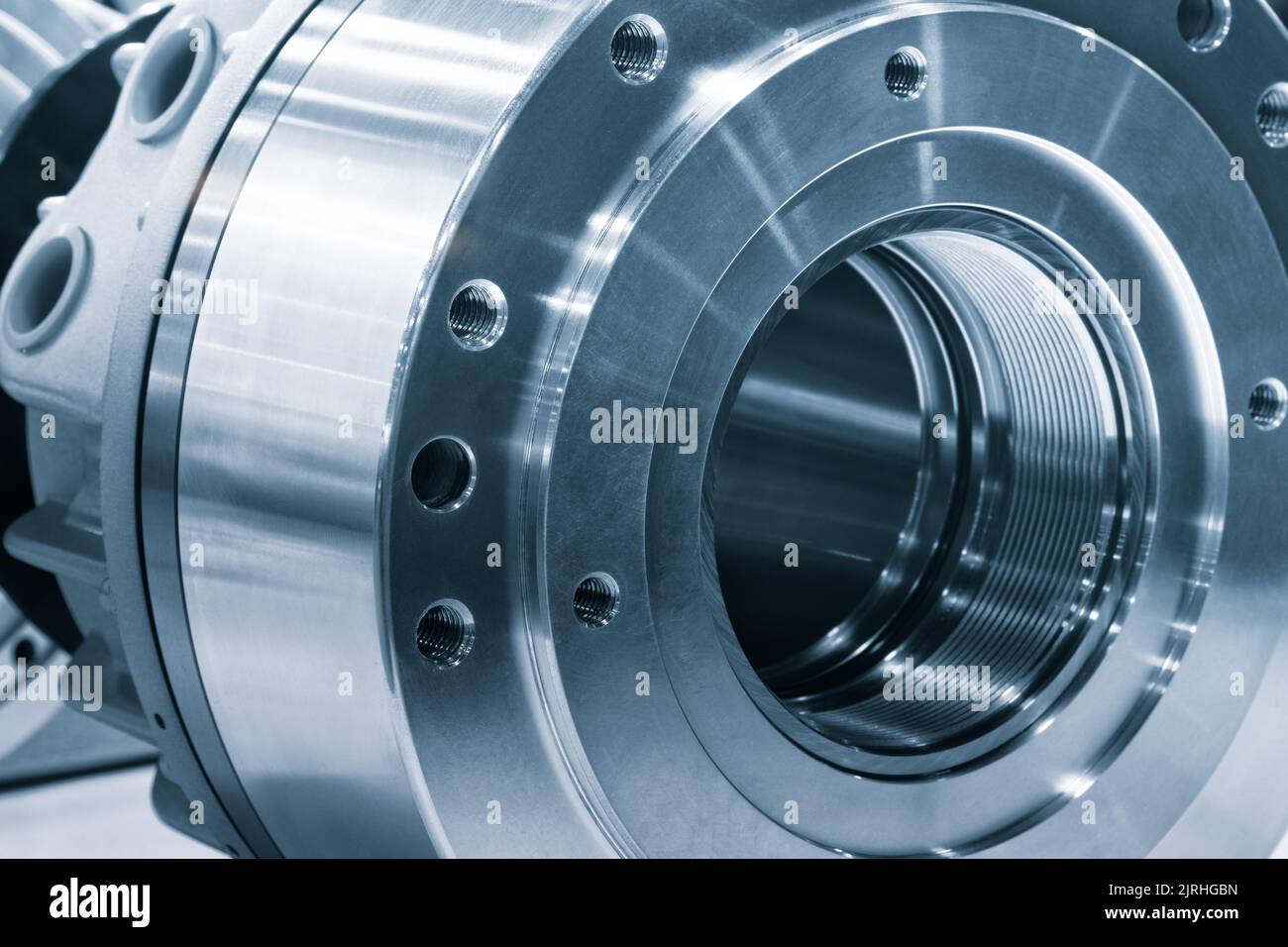 Industrial metalworking concept background, shiny metal shaft close up ...