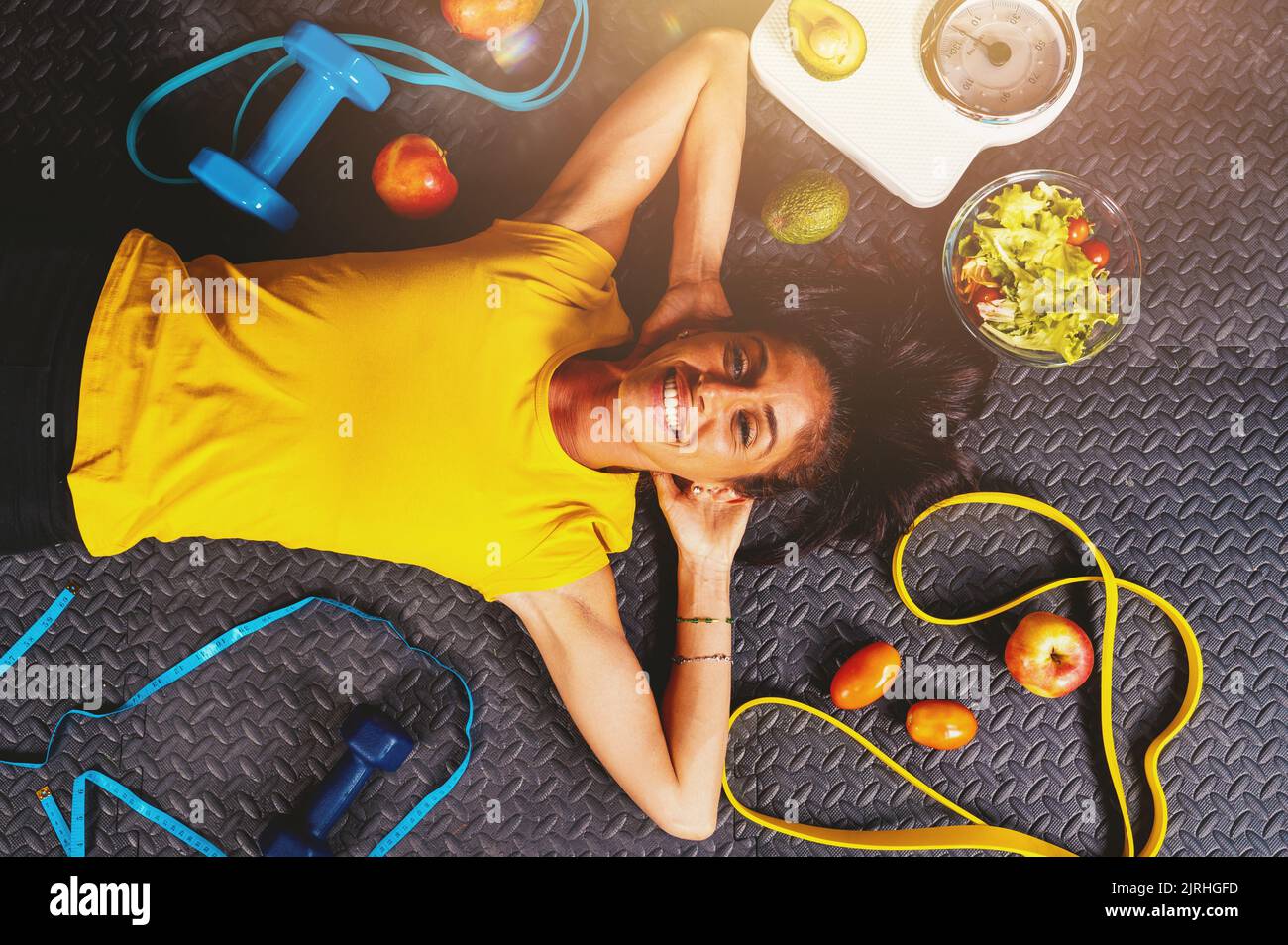 Happy woman does exercises with elastic at the gym Stock Photo - Alamy