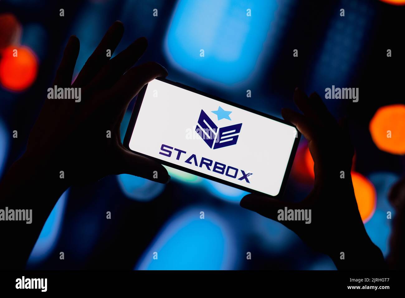In this photo illustration, the StarBox Holdings logo is displayed on a ...