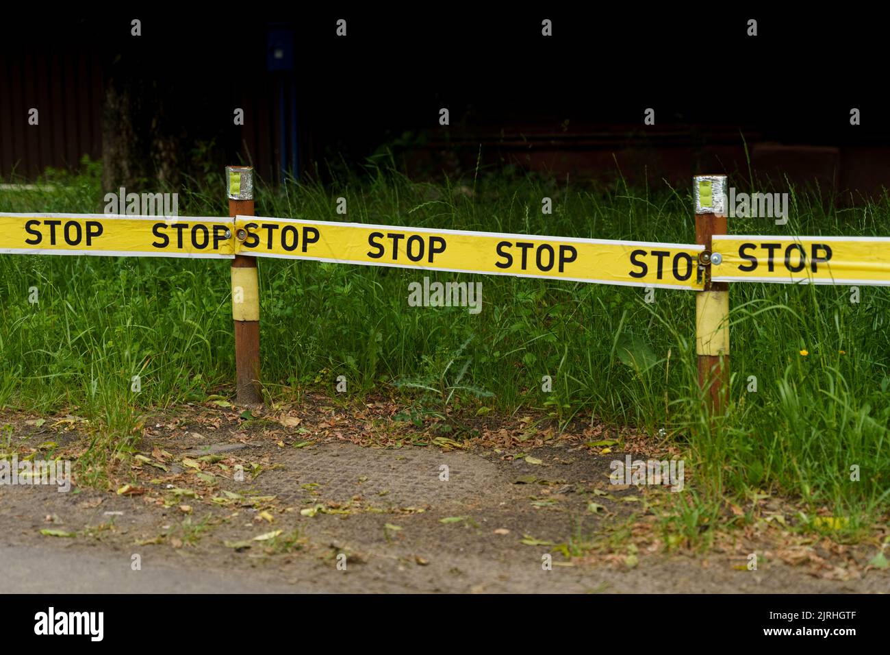 Security concept. Yellow restrictive tape with the inscription - Stop ...