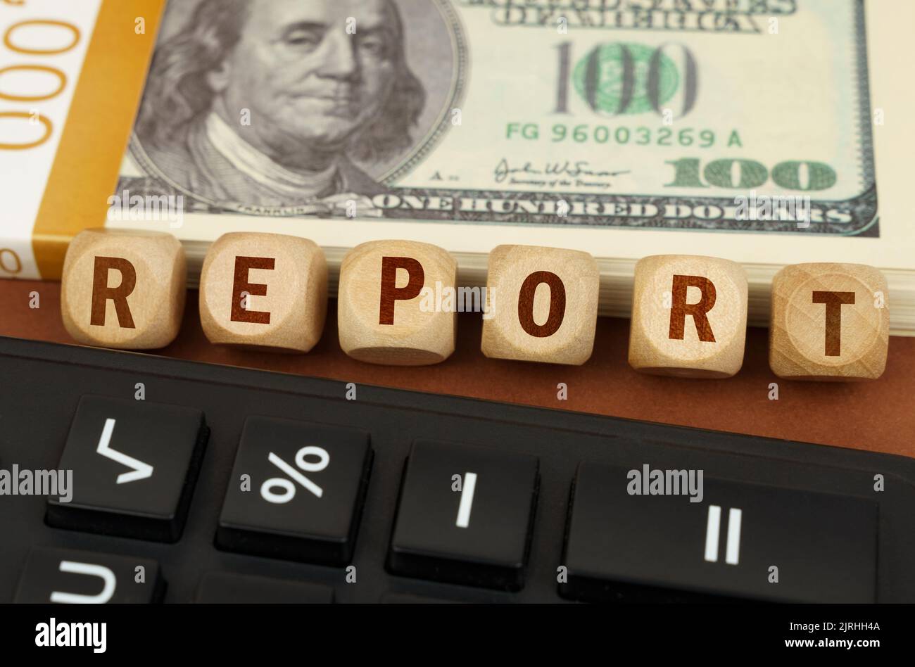 Business concept. Next to the calculator and dollars are cubes with the ...