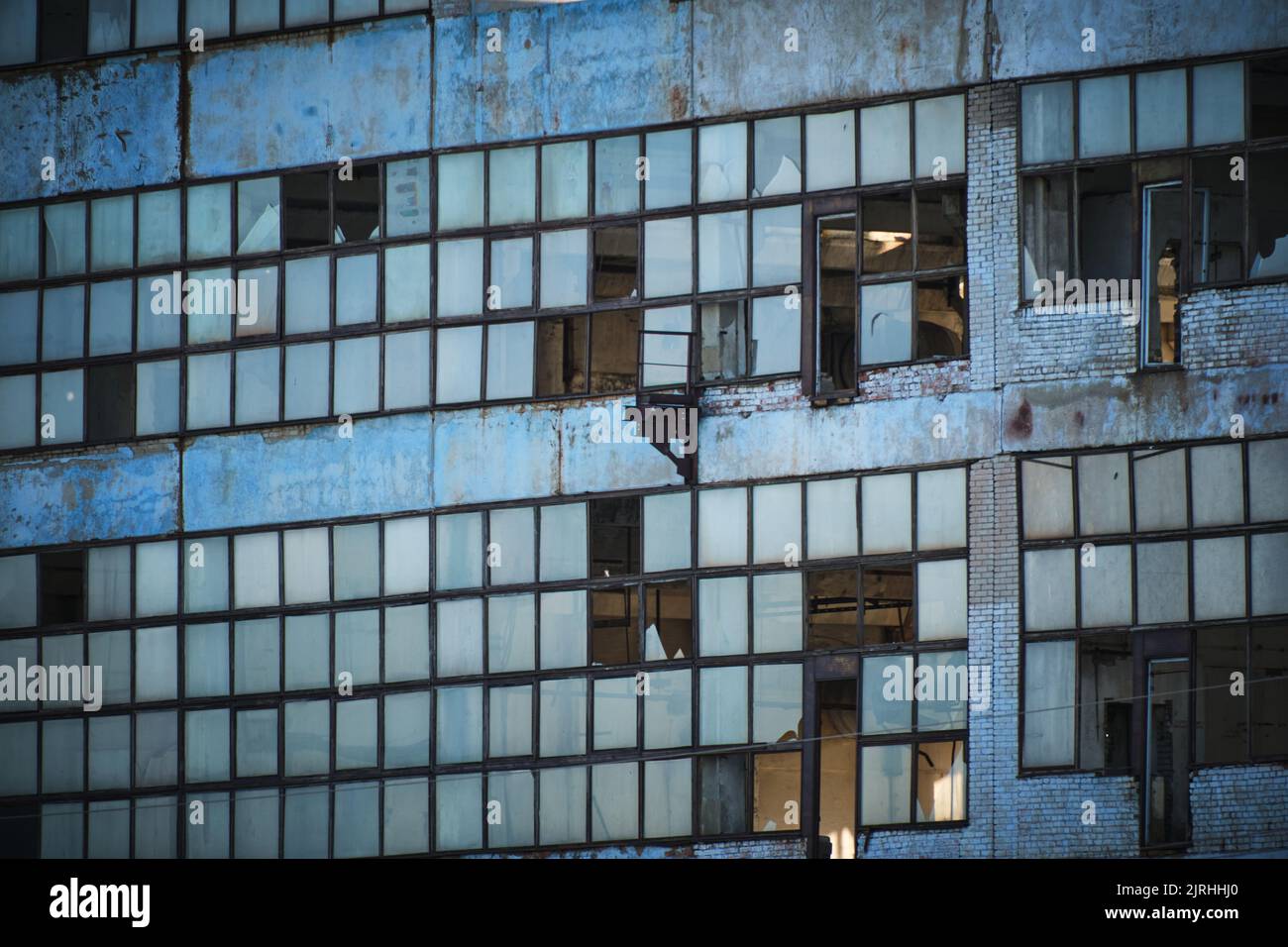 Broken glass facade old, industrial, abandoned factory building Stock ...