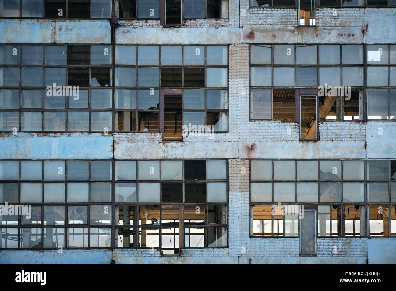 Broken glass facade old, industrial, abandoned factory building Stock ...