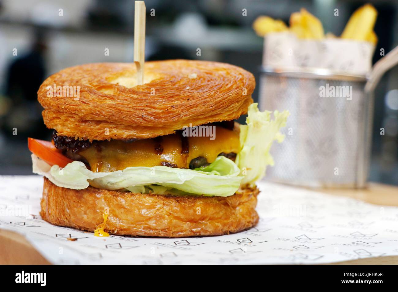 classic beef and cheese burger with butter croissant bun Stock Photo ...