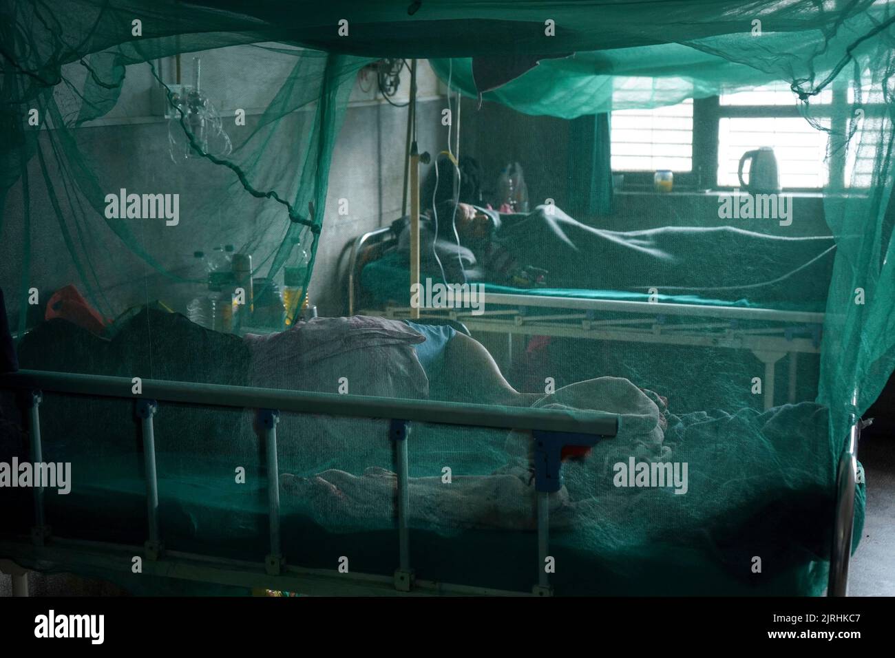 Kathmandu, Nepal. 24th Aug, 2022. A patient suffering from dengue rests ...