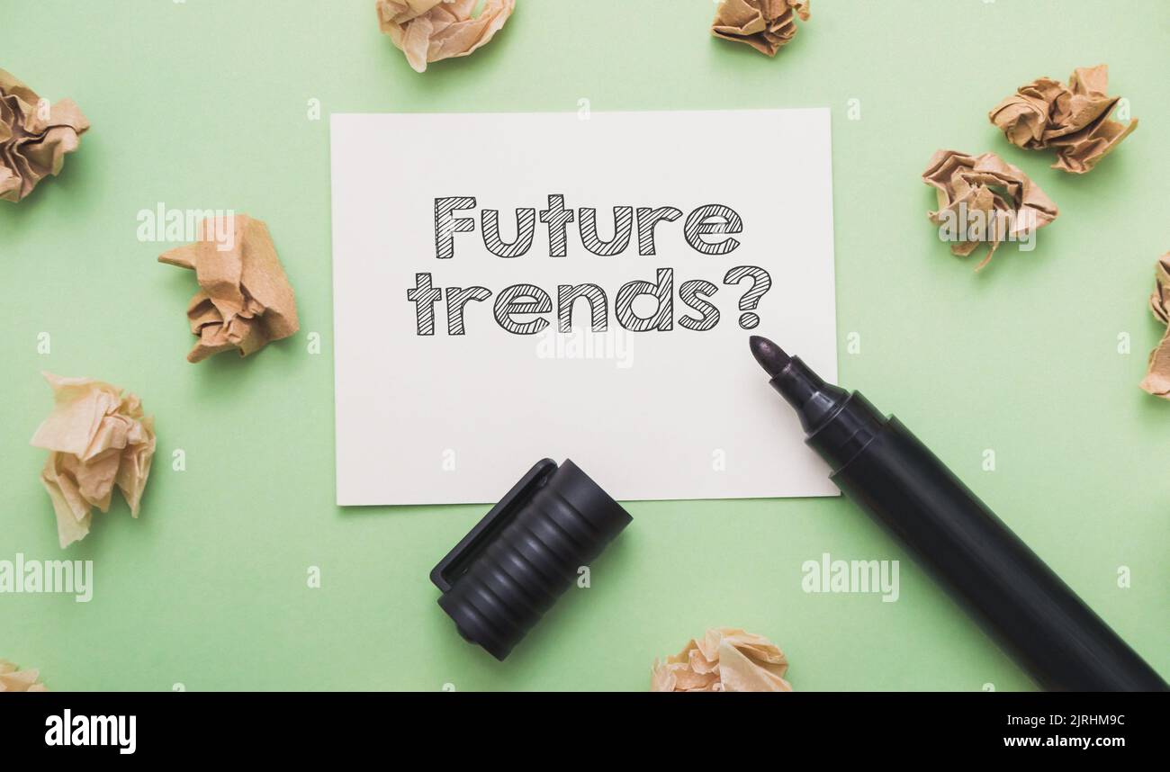 Card with question Future Trends on green background Stock Photo - Alamy