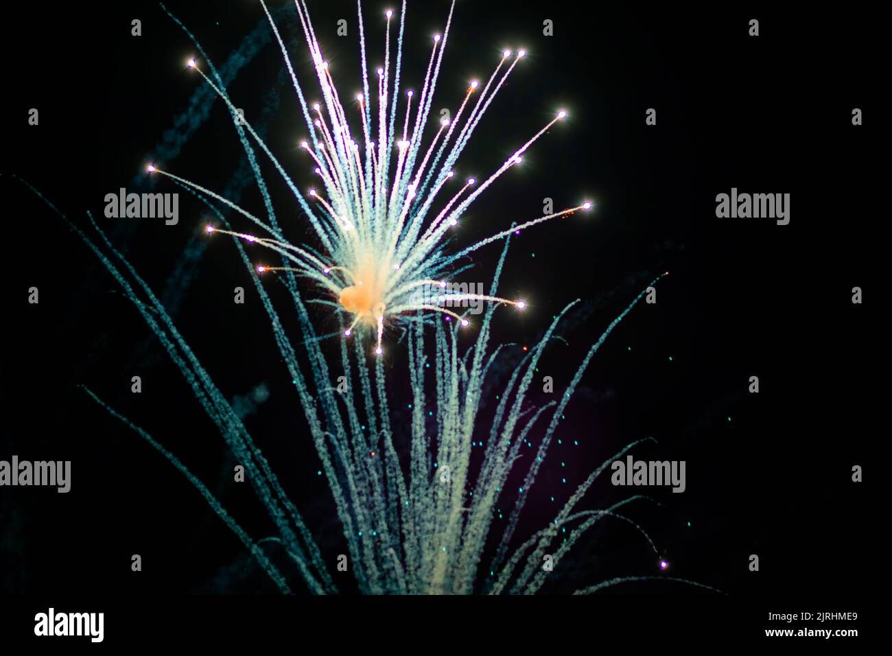 Bright light flash of fireworks, against the background of the night ...