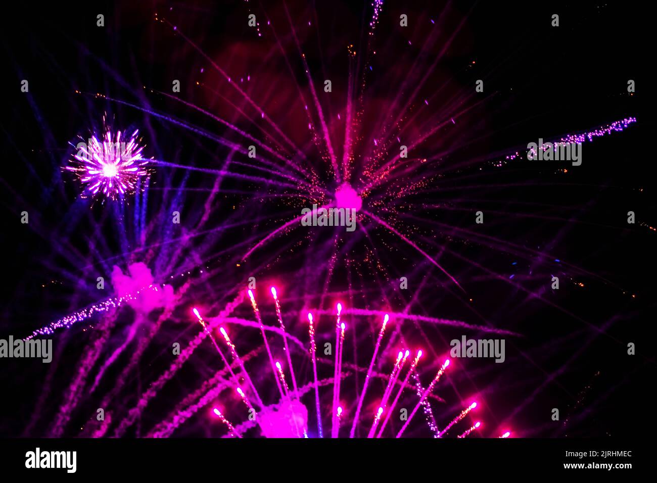 Bright, beautiful purple fireworks in the night sky Stock Photo - Alamy