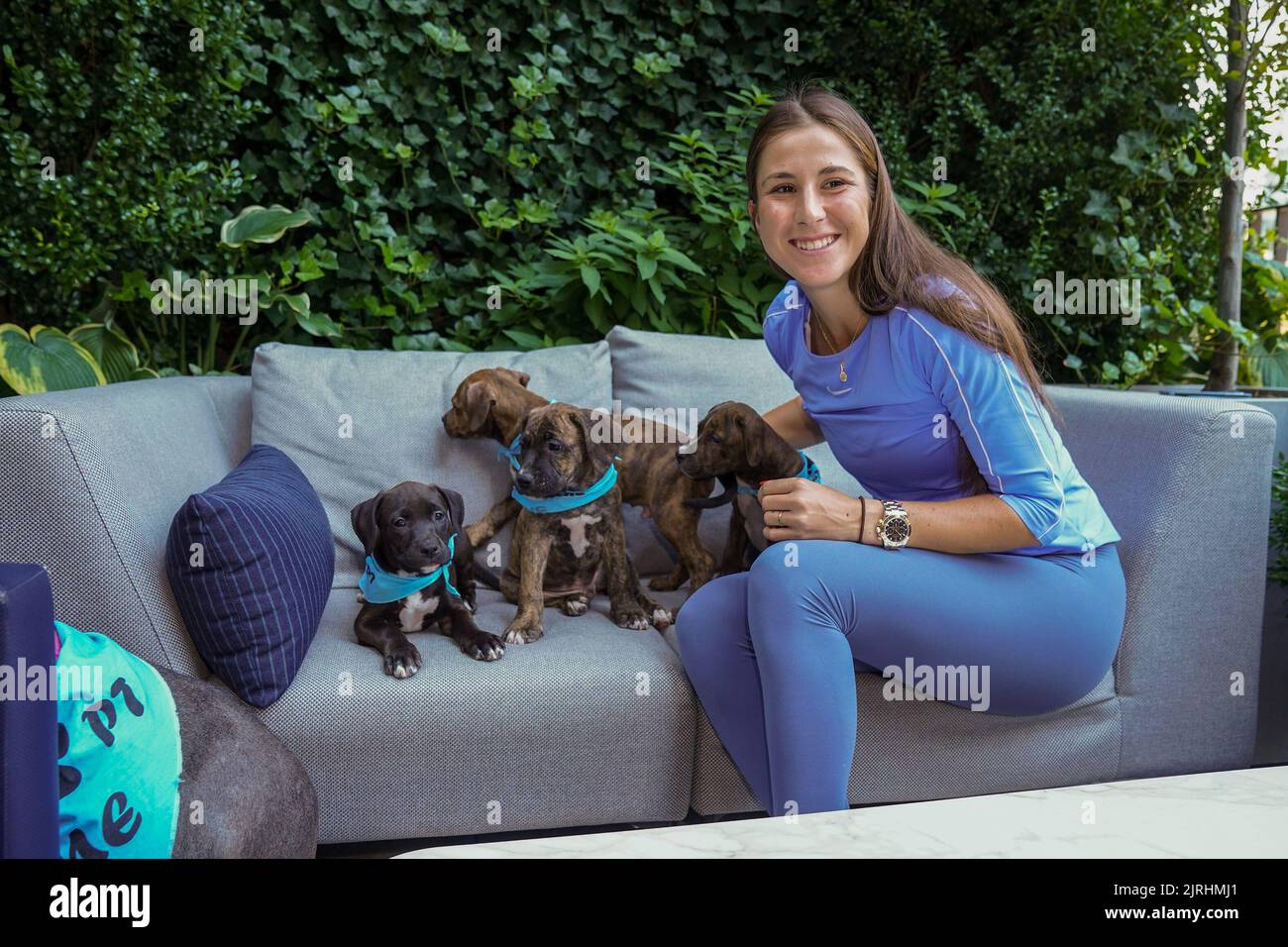 Alex de Minaur and Belinda Bencic attend the Bark Terrace Puppy Latte ...