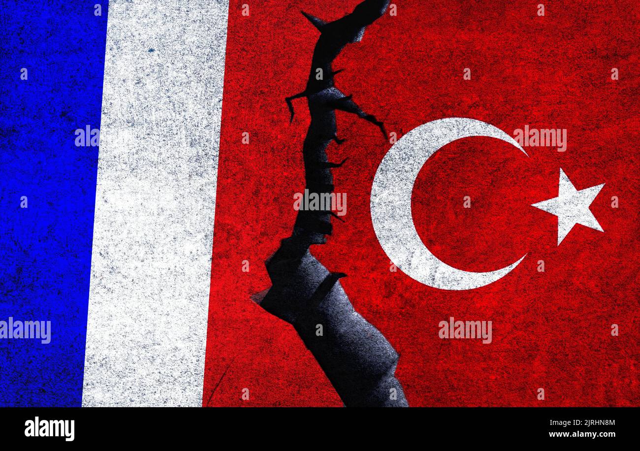 Turkey vs France concept flags on a wall with a crack. France and ...