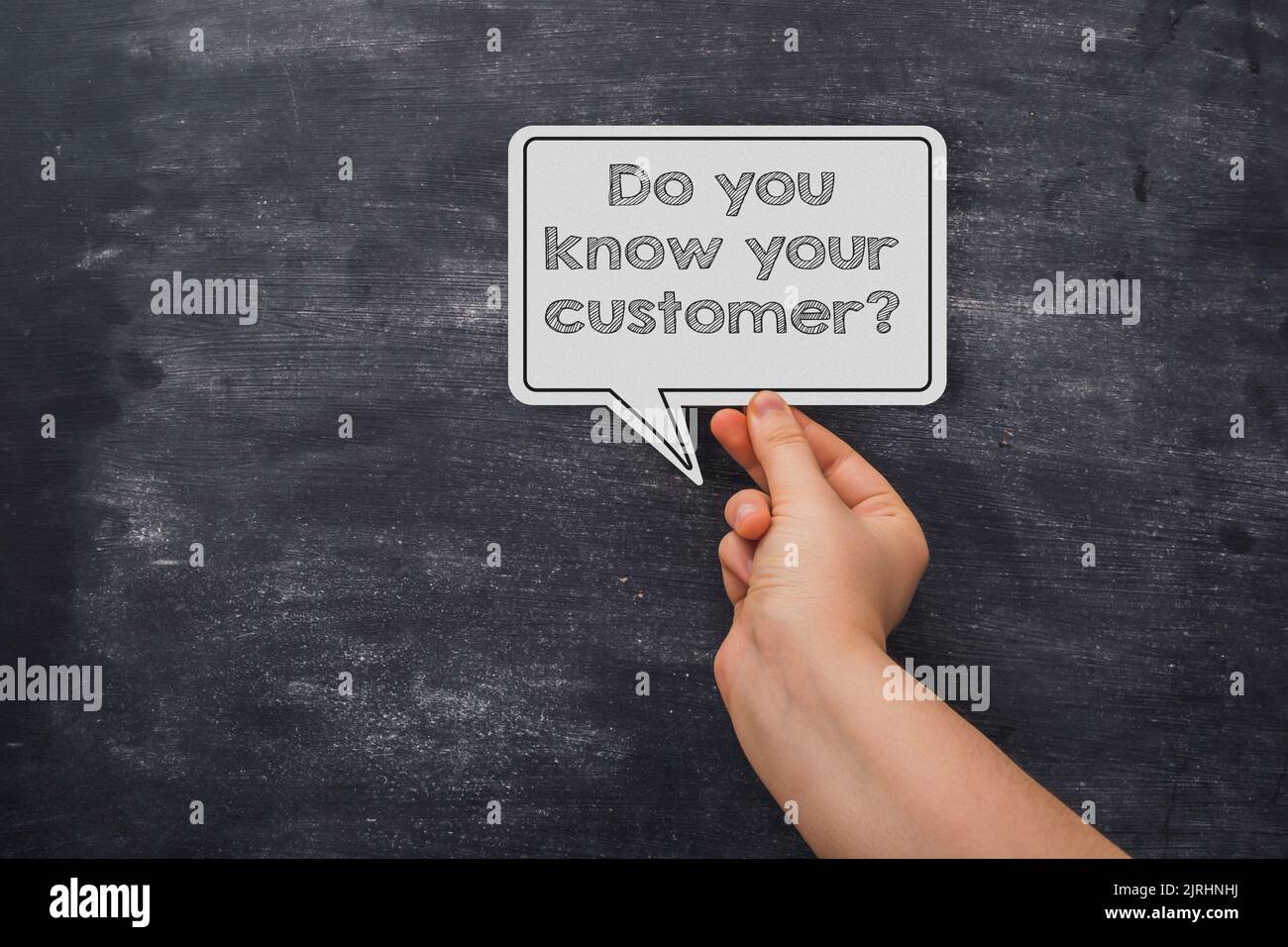 Woman holds card with words Do you Know your Customers Stock Photo - Alamy