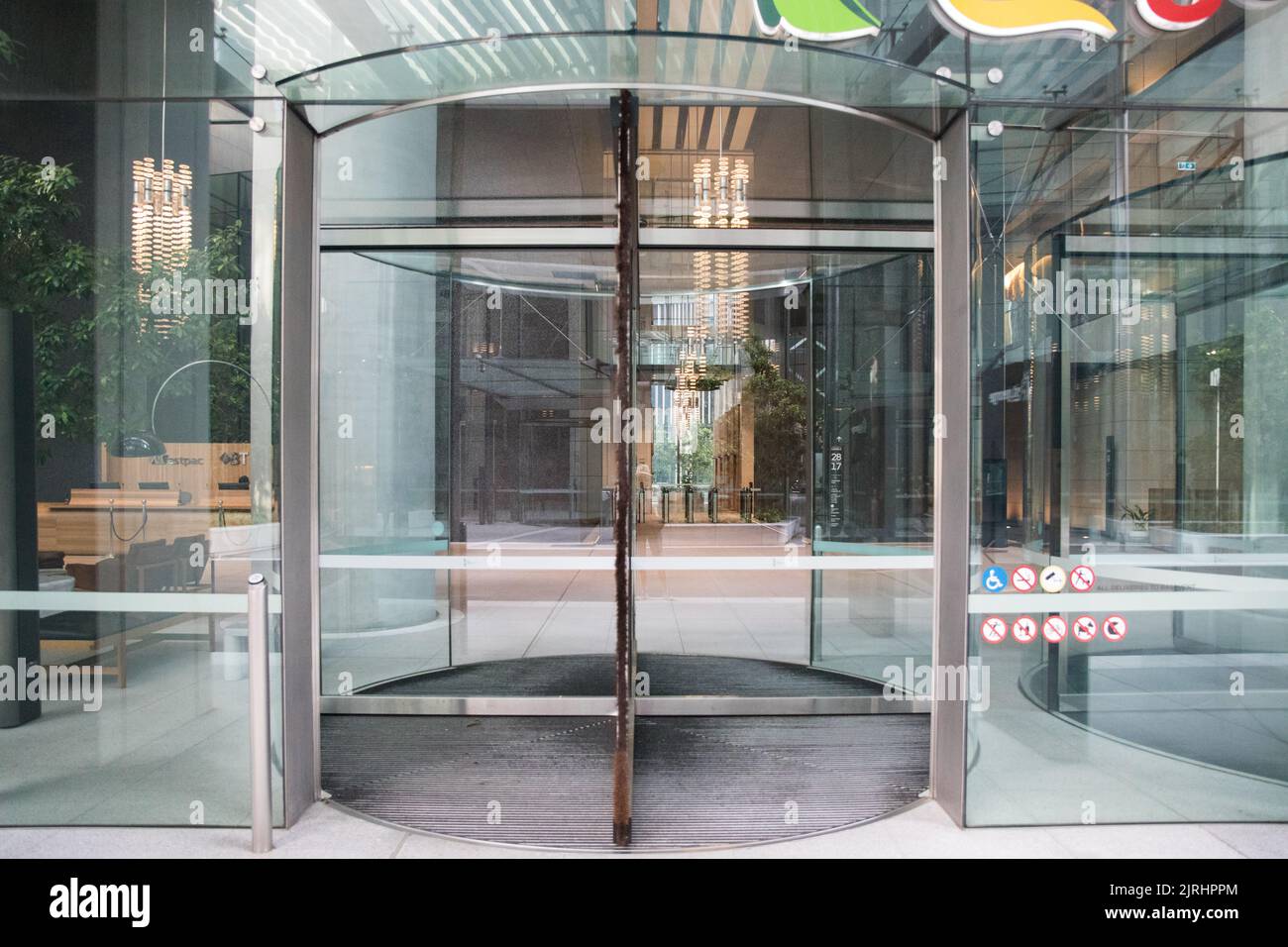 The revolving glass doors in office building Stock Photo - Alamy