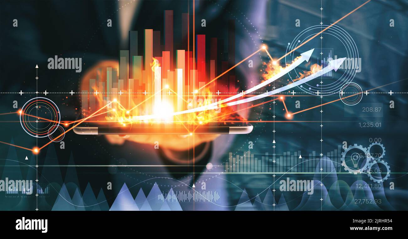 Hot business growth. Businessman using tablet analyzing sales data and ... Hot business growth. Businessman using tablet analyzing sales data and ...