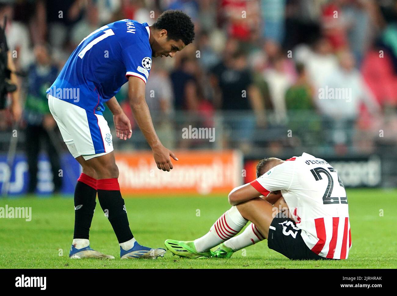 Rangers' Malik Tillman (left) consoles PSV Eindhoven's Joey Veerman ...