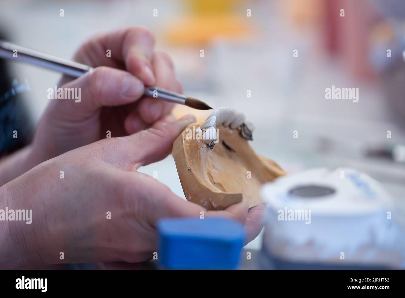 Prosthetics hands while working on the denture, false teeth, a study ...