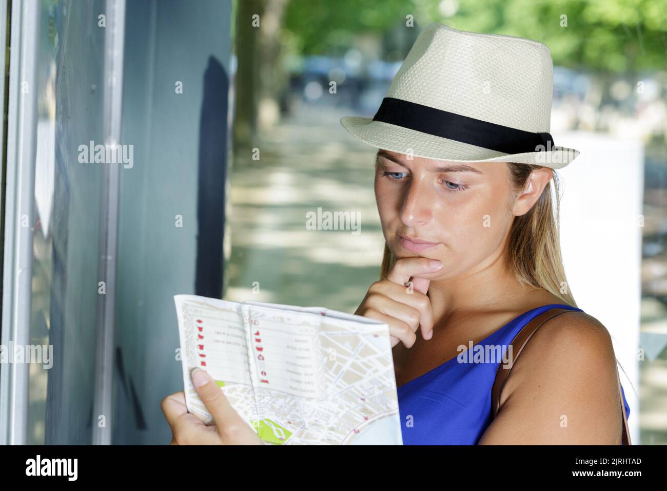 young girl waiting for bus at bus station Stock Photo - Alamy